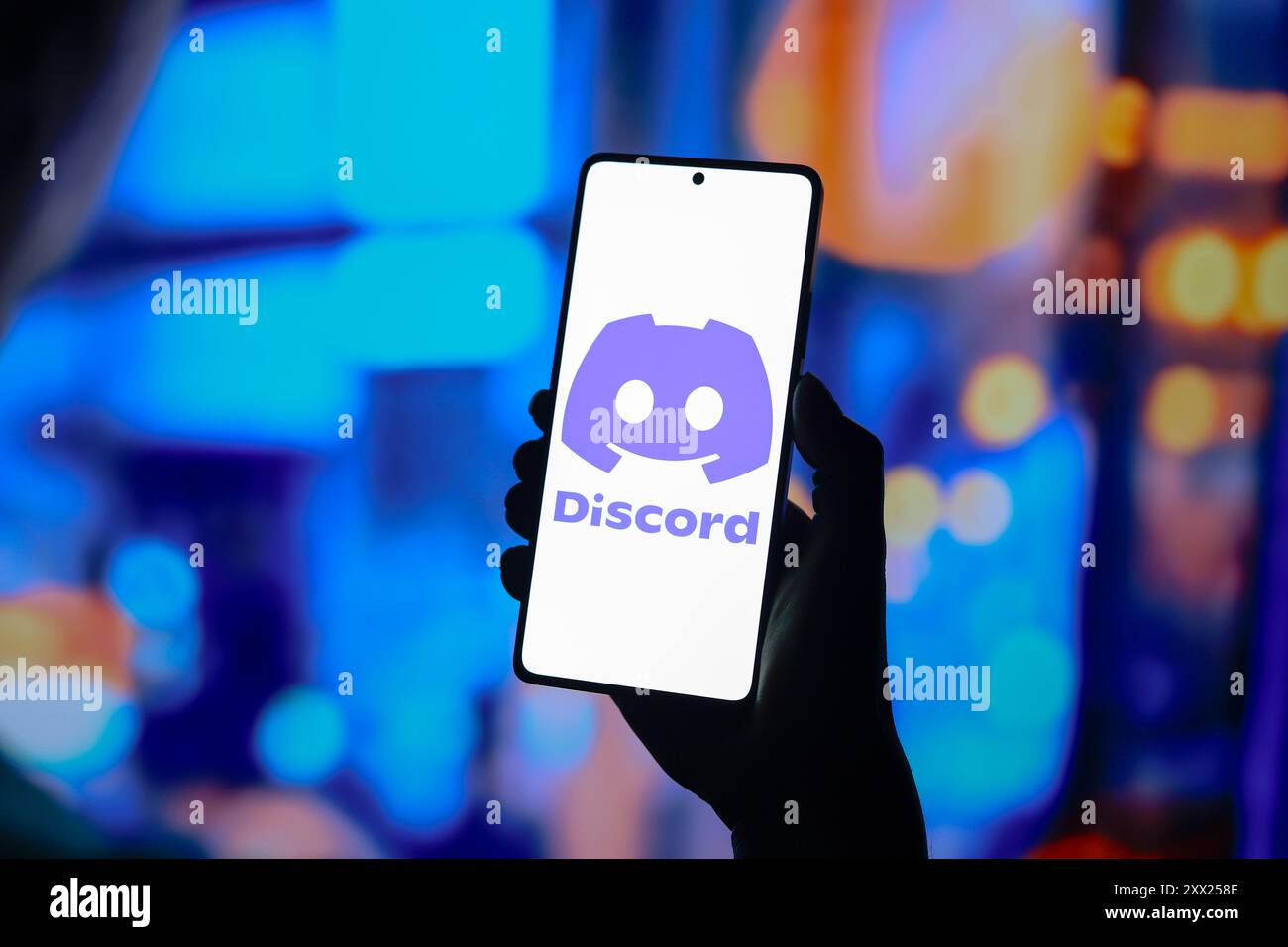 In this photo illustration, the Discord logo is displayed on a ...