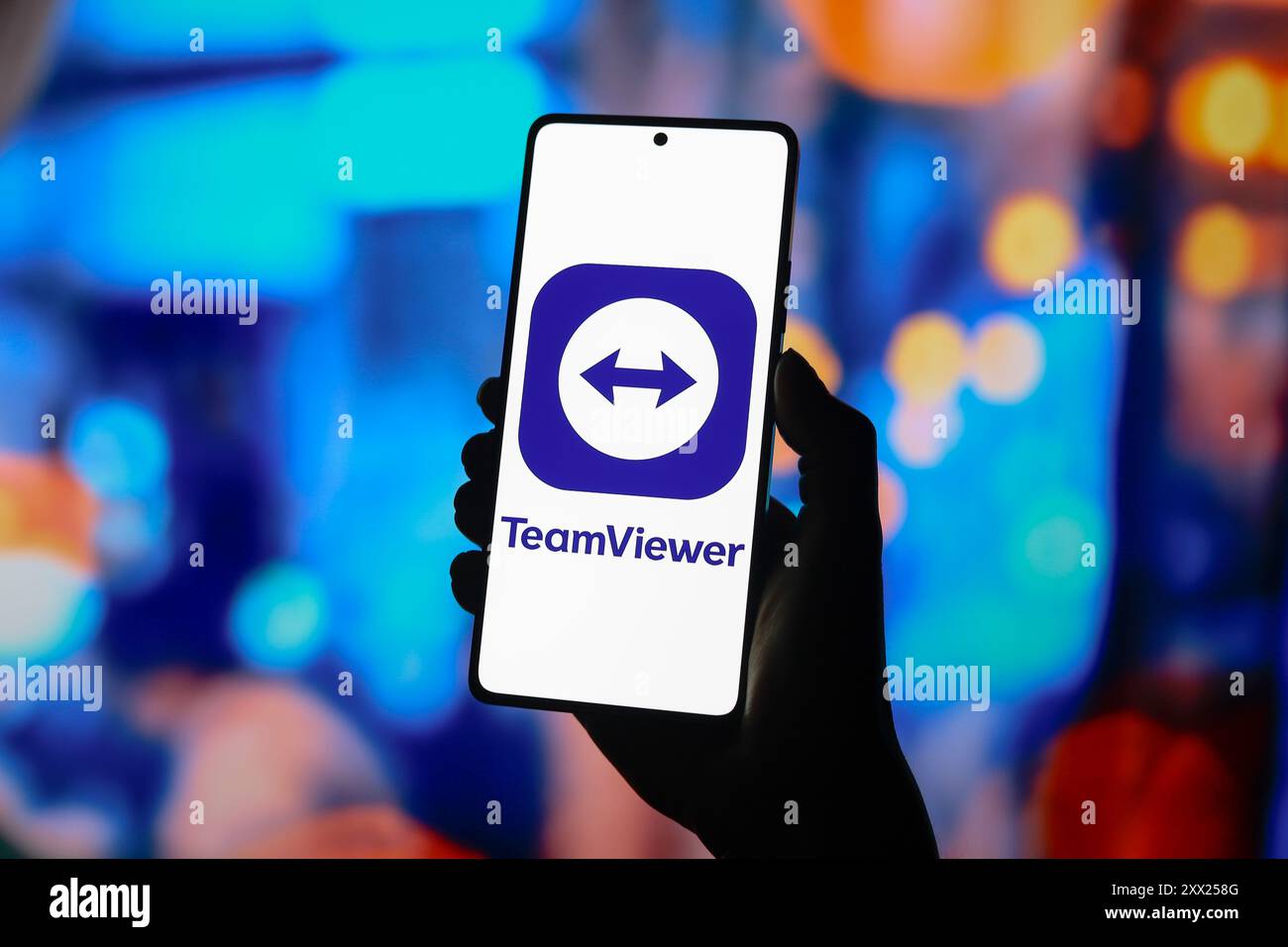 In this photo illustration, the TeamViewer logo is displayed on a ...