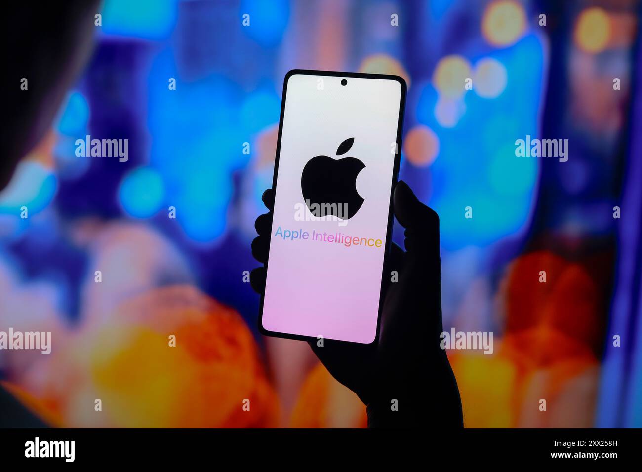 In this photo illustration, the Apple Intelligence logo is displayed on ...