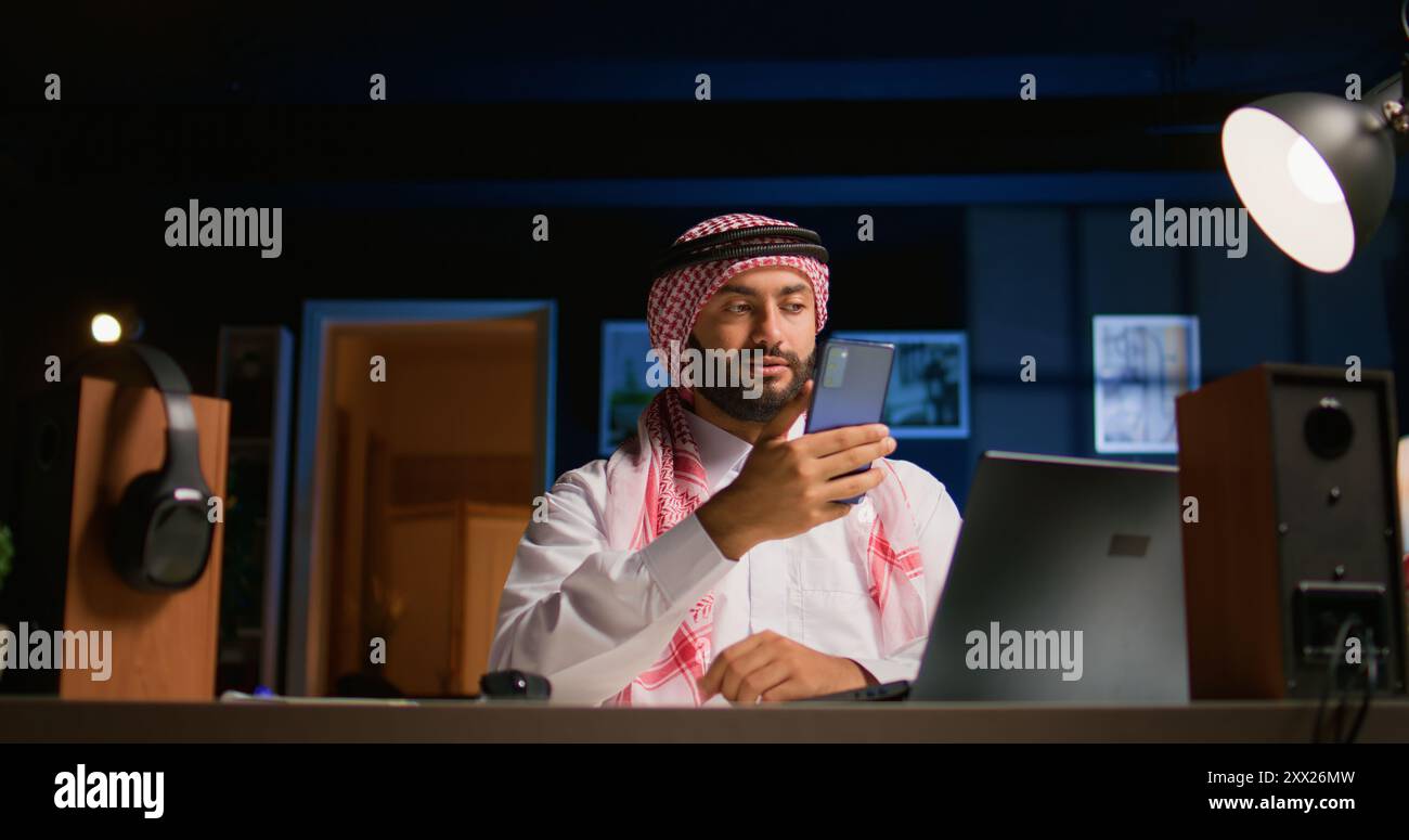 Arab man checking up on close friend during video conference meeting ...
