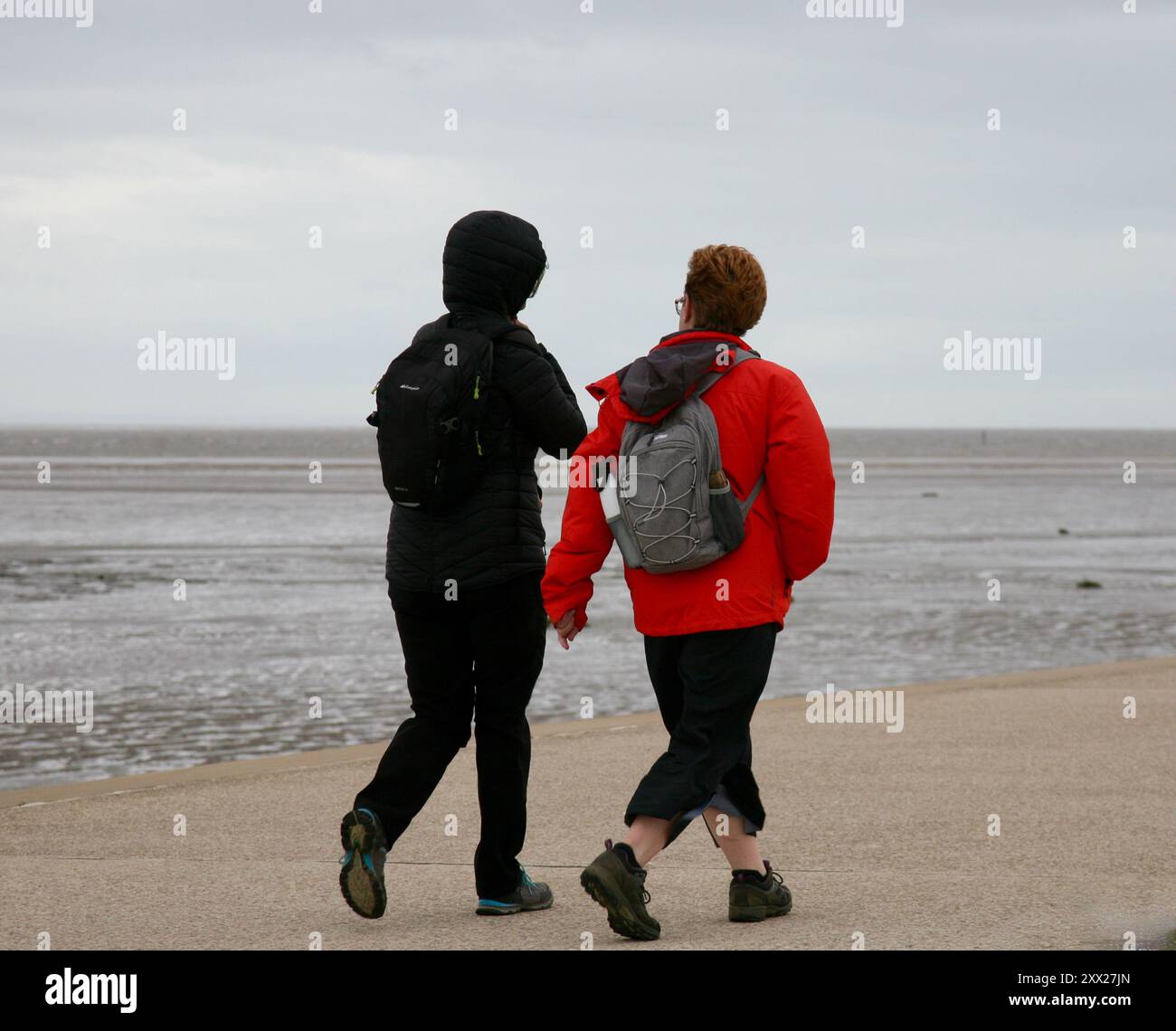 Ladies walking together on the beach hi-res stock photography and ...
