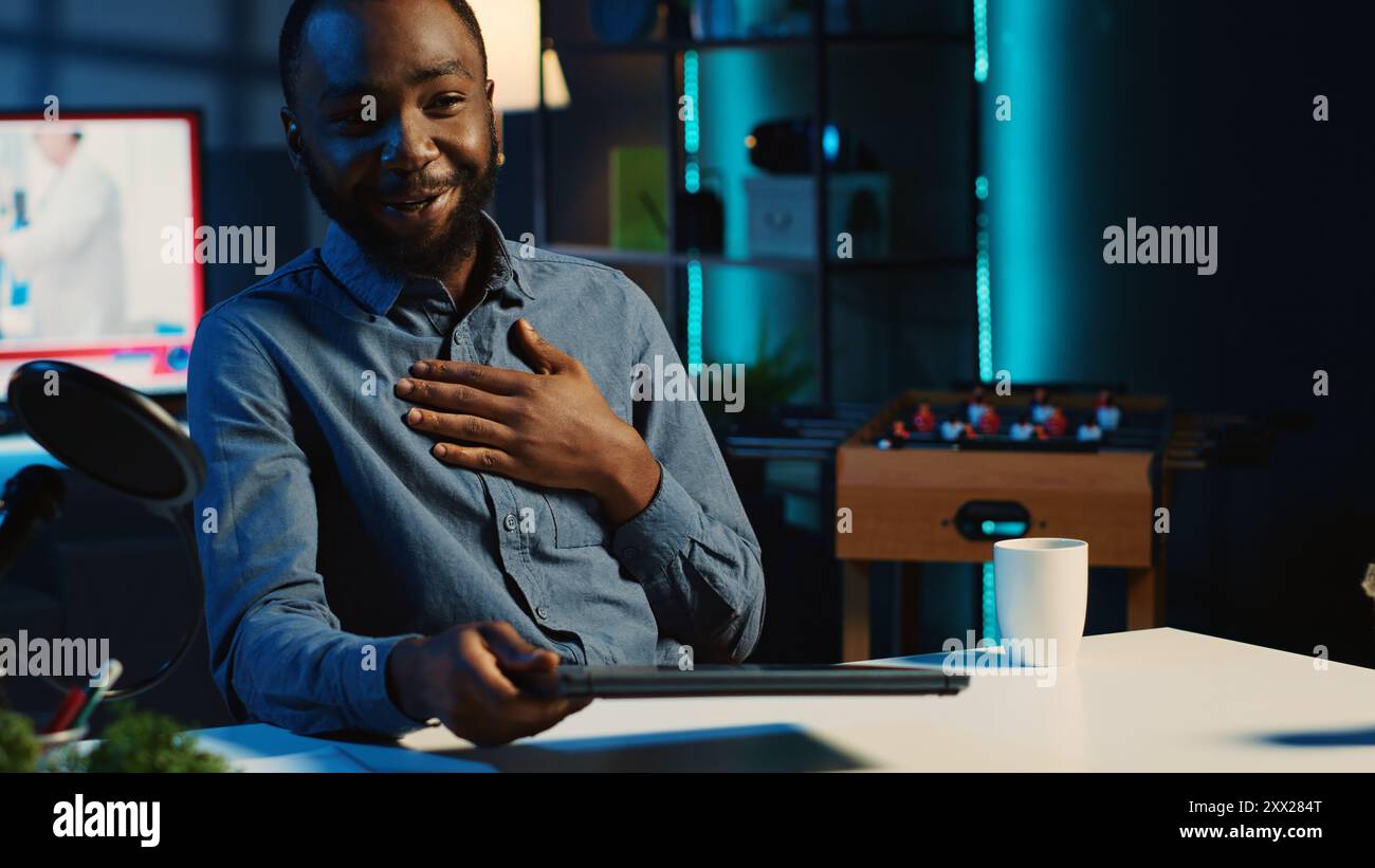 African american content creator filming technology review of newly ...