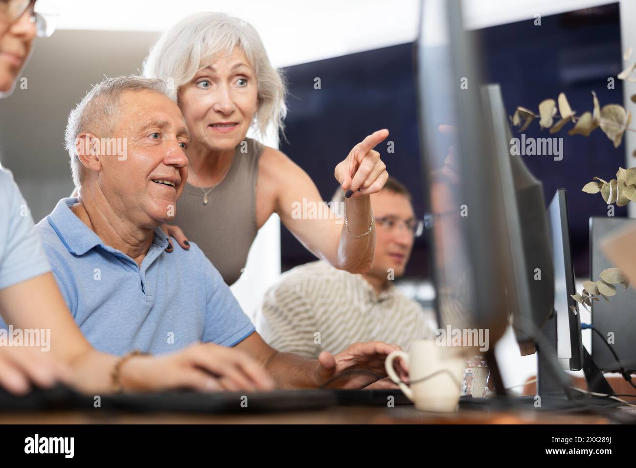 Group of older people studying on computer course Stock Photo - Alamy