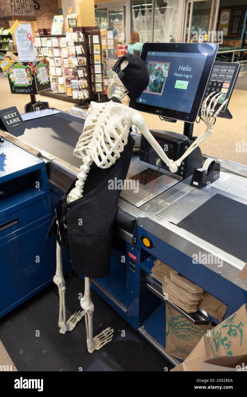 Skeleton working computer screen at grocery store checkout operating hi-res stock photography ...