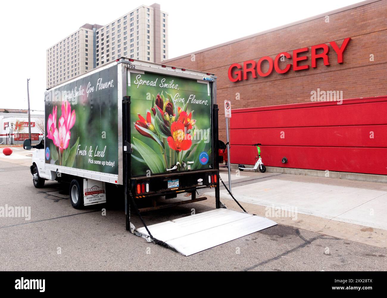 Florist from the Busch Flower Farm delivering flowers from a ...