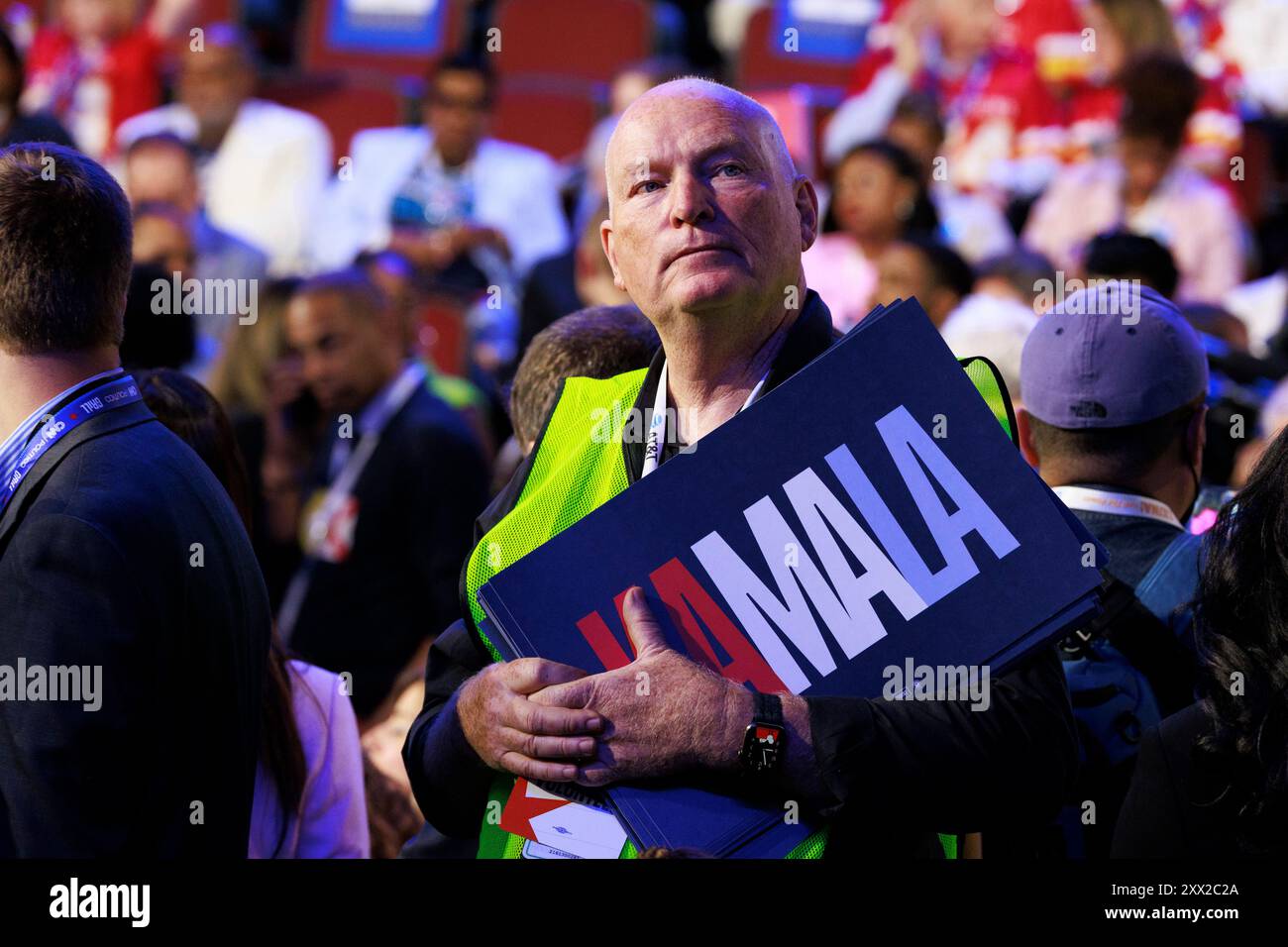 A delegate holds a Kamala sign during the second day of the Democratic ...