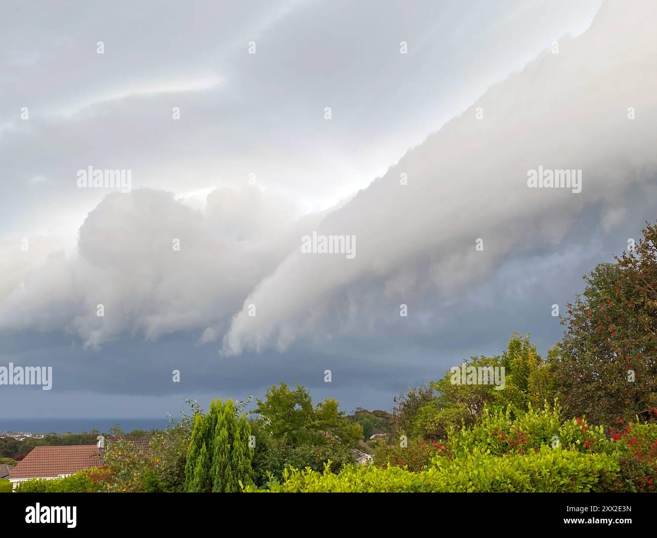 Roll cloud races across the sky above Onchan Isle of Man infant of a ...