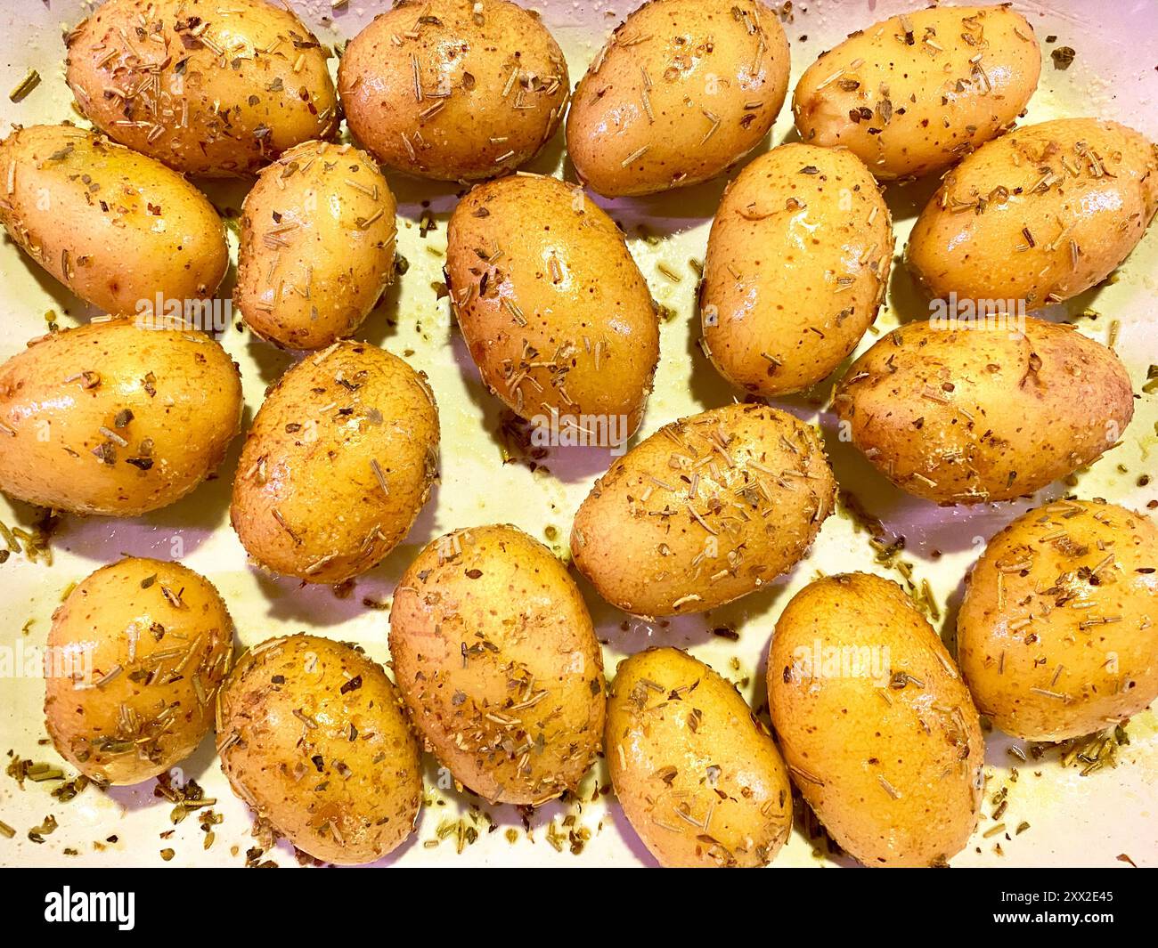 Roast baby potatoes with herbs and seasoning Stock Photo - Alamy
