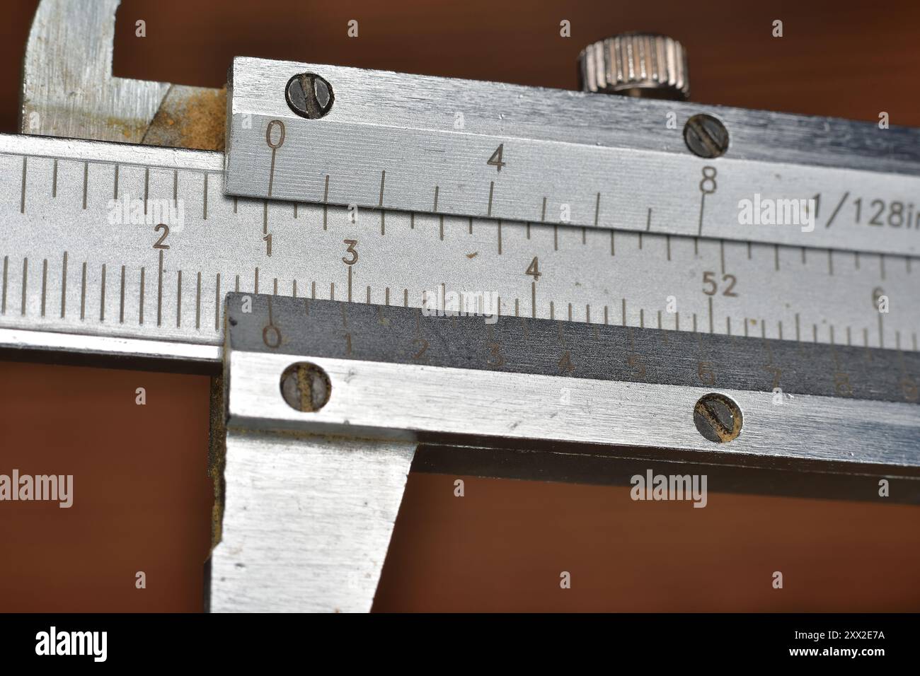 Caliper for precision measuring graduated in fractional inches and ...