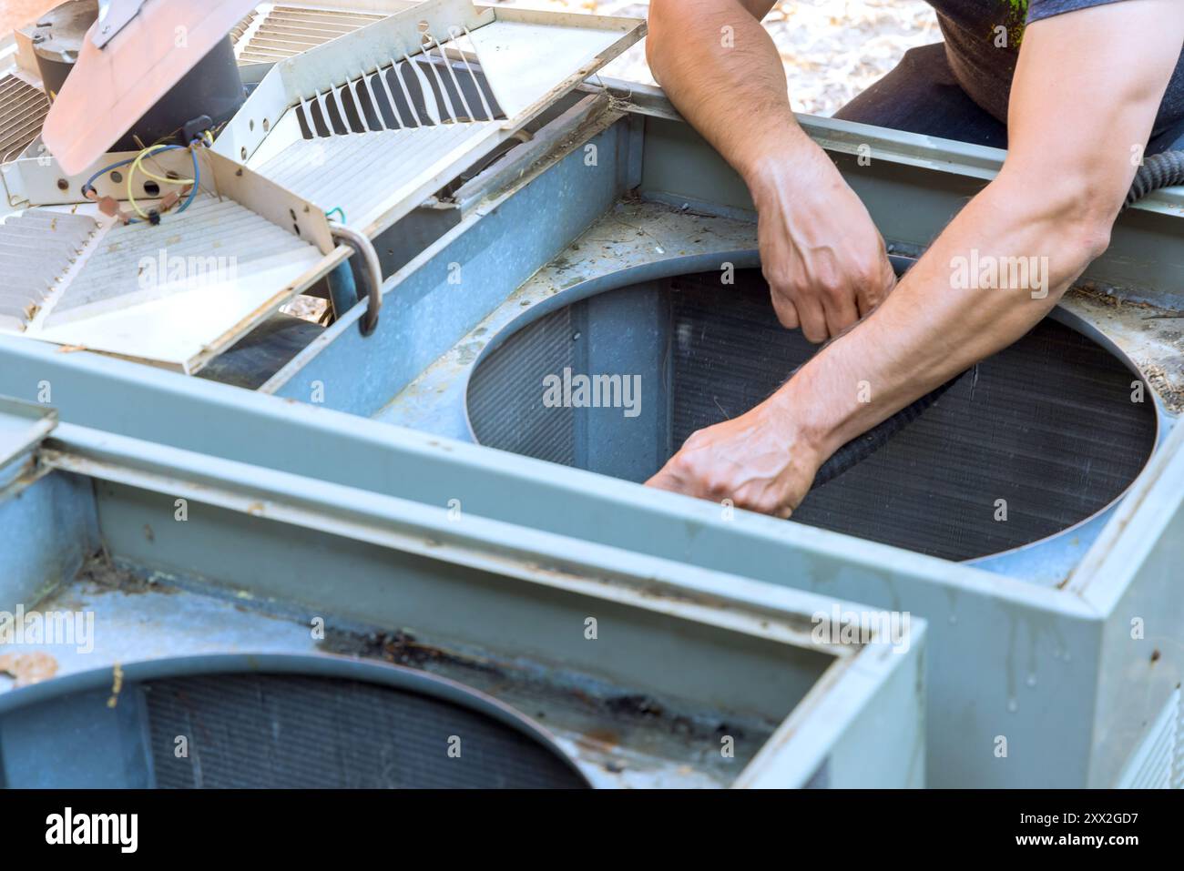 Service repair maintenance work is performed by employee on outdoor ...