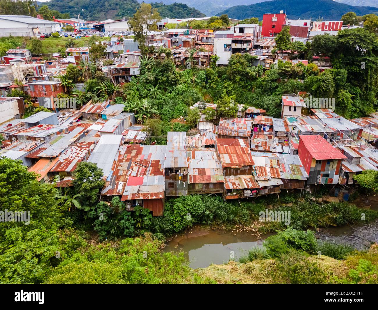 Aerial View of the ghetto, slum neighborhoods tin house next to the ...