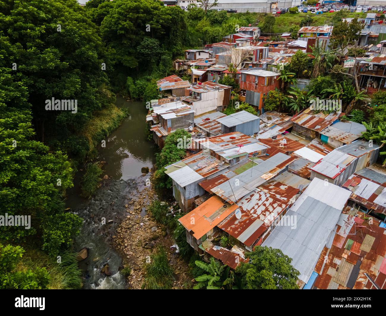 Aerial View of the ghetto, slum neighborhoods tin house next to the ...