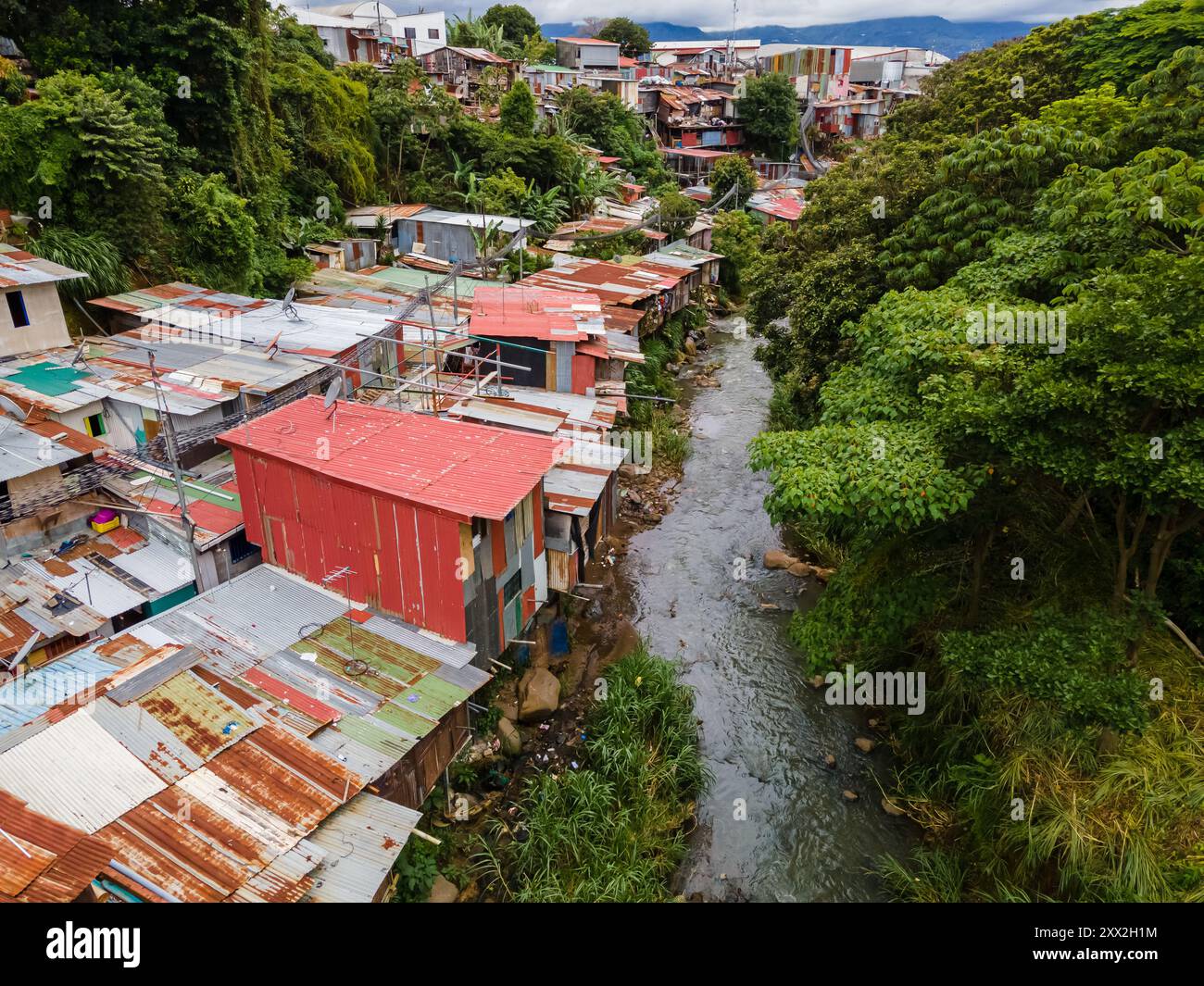 Aerial View of the ghetto, slum neighborhoods tin house next to the ...