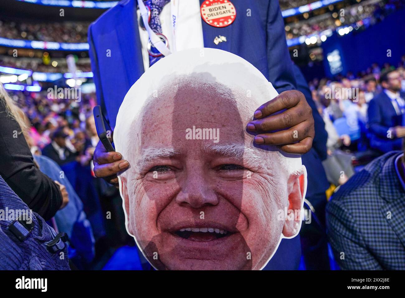 Chicago, USA. 21st Aug, 2024. An attendee carries a sign with the face ...