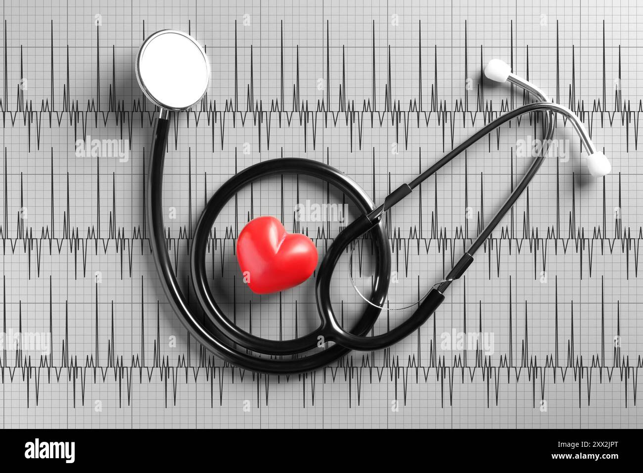 Red decorative heart, stethoscope on electrocardiogram printout, top ...