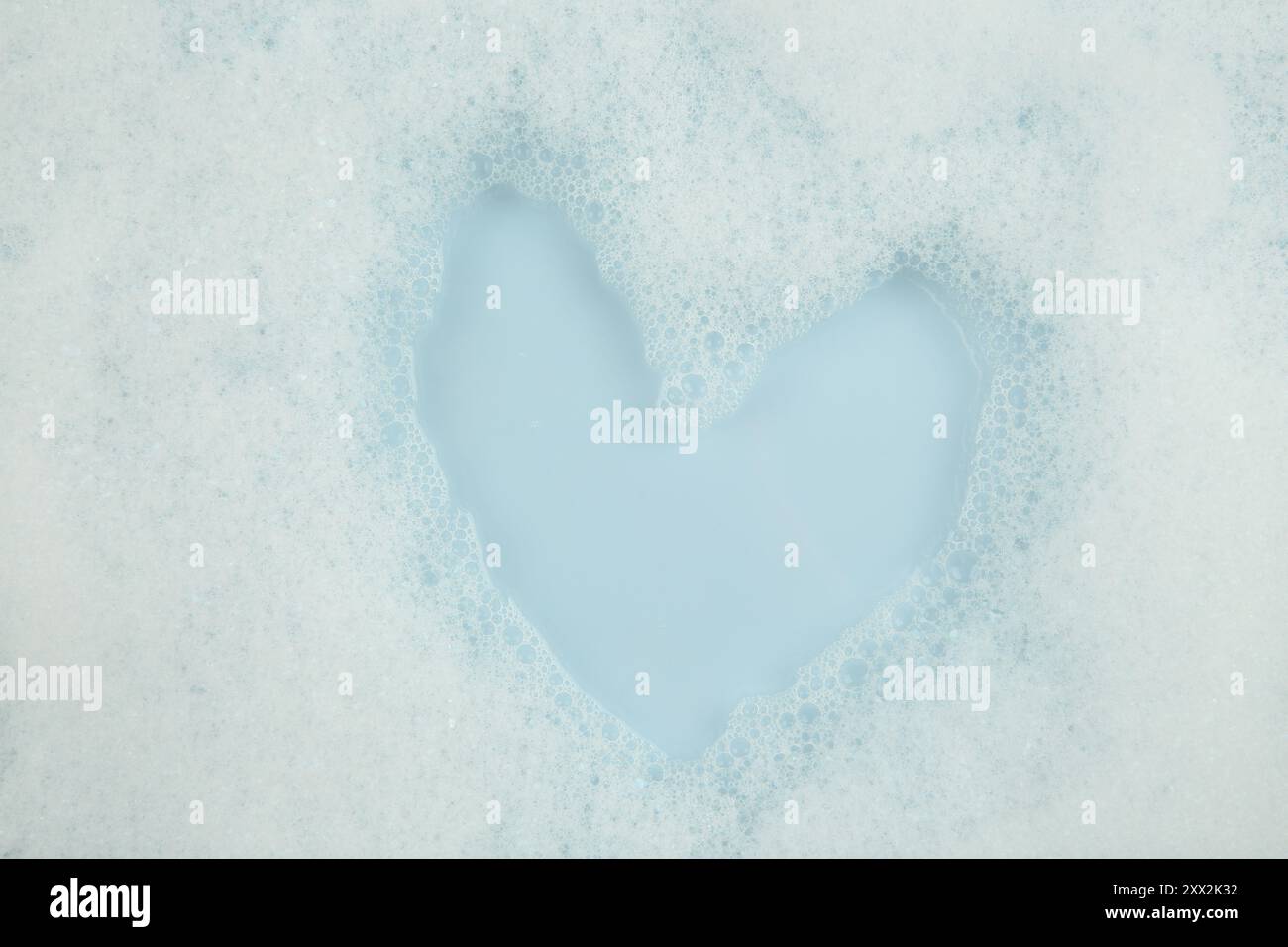 Washing laundry. Water with foam, top view Stock Photo - Alamy