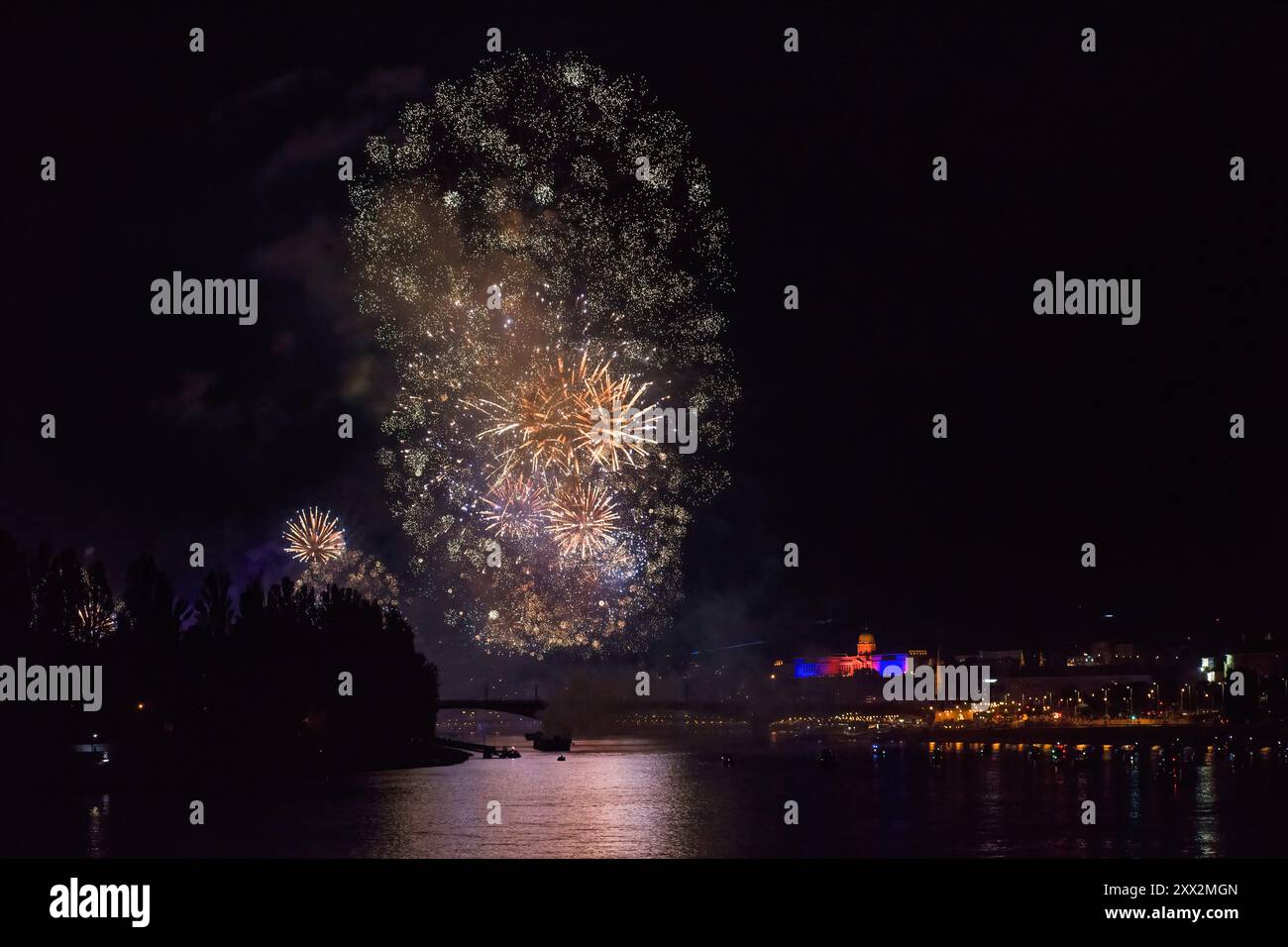 Spectacular fireworks are held above the Danube river in Budapest during the Saint Stephen's Day ...
