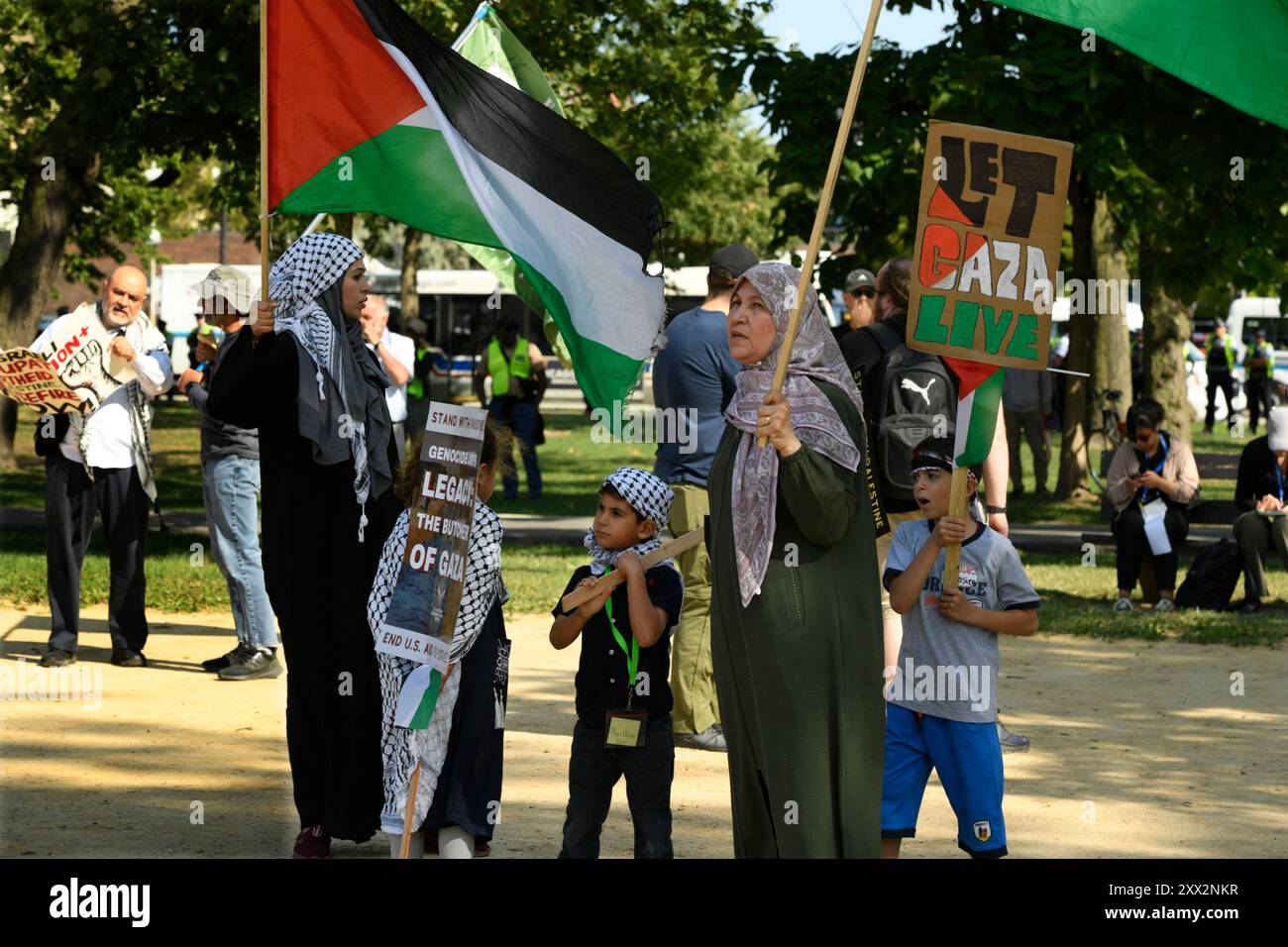 Protesters hold signs before hi-res stock photography and images - Alamy