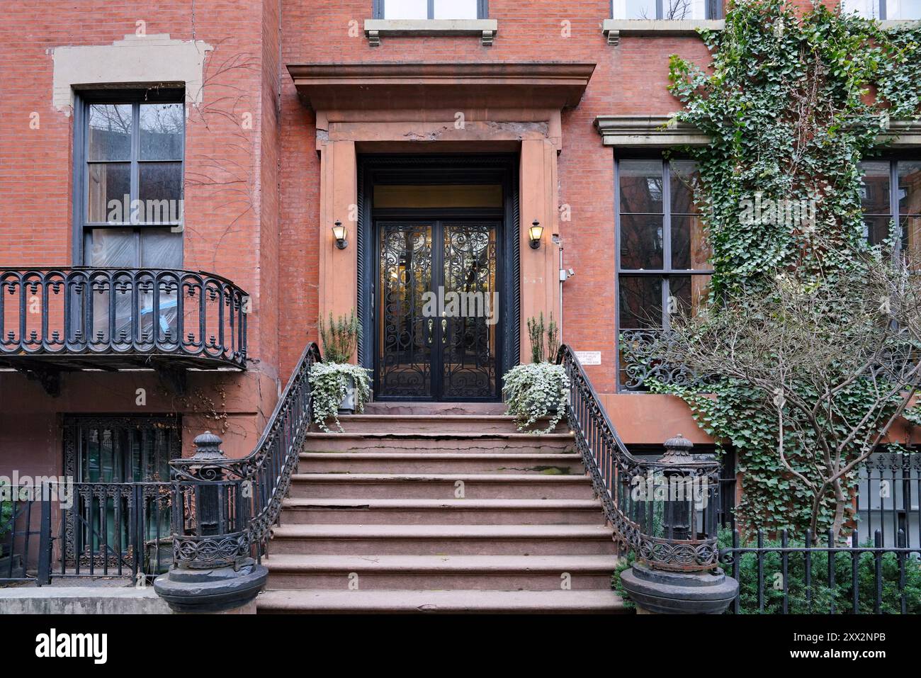 New York, front steps of old apartment building with ornate wrought ...
