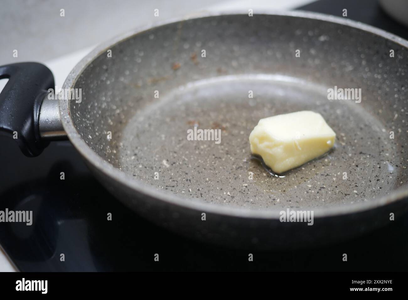 A Piece of Butter Melting Delightfully in a NonStick Frying Pan at the ...