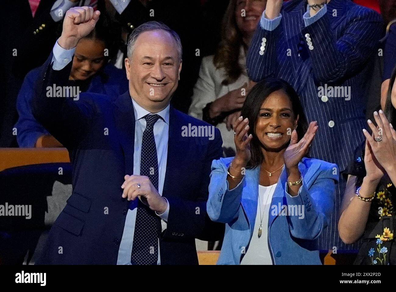 Second Gentalman Douglas Emhoff and Maya Harris clap during the ...