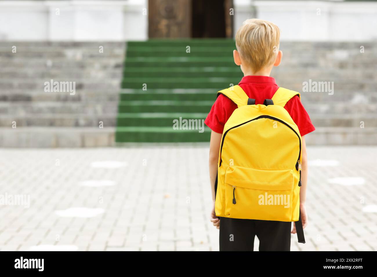 Cute little boy with backpack going to school Stock Photo - Alamy