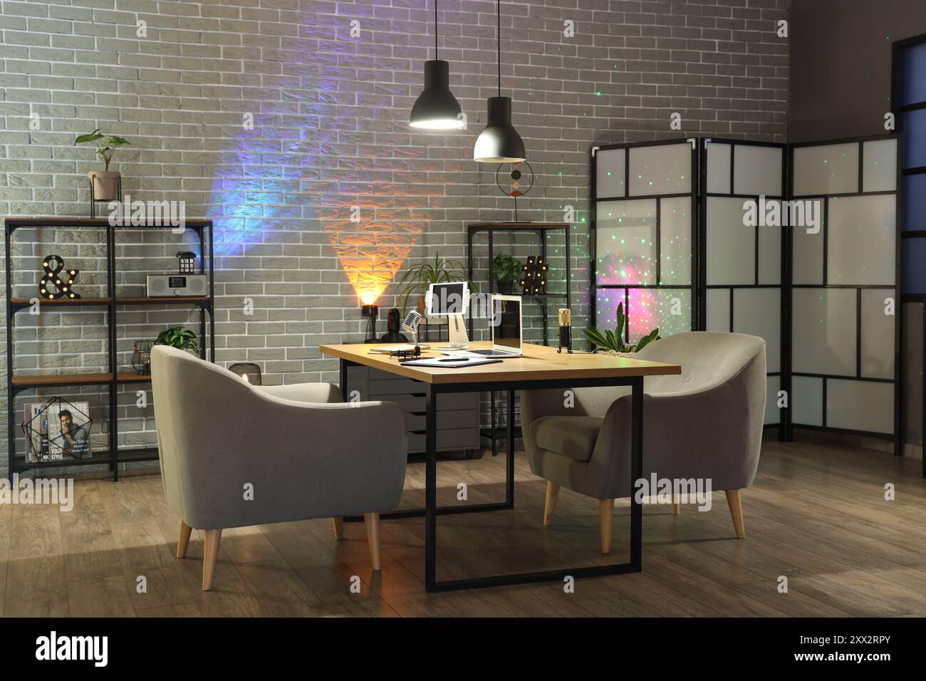 Interior of dark studio with podcaster's workplace, shelf units and ...