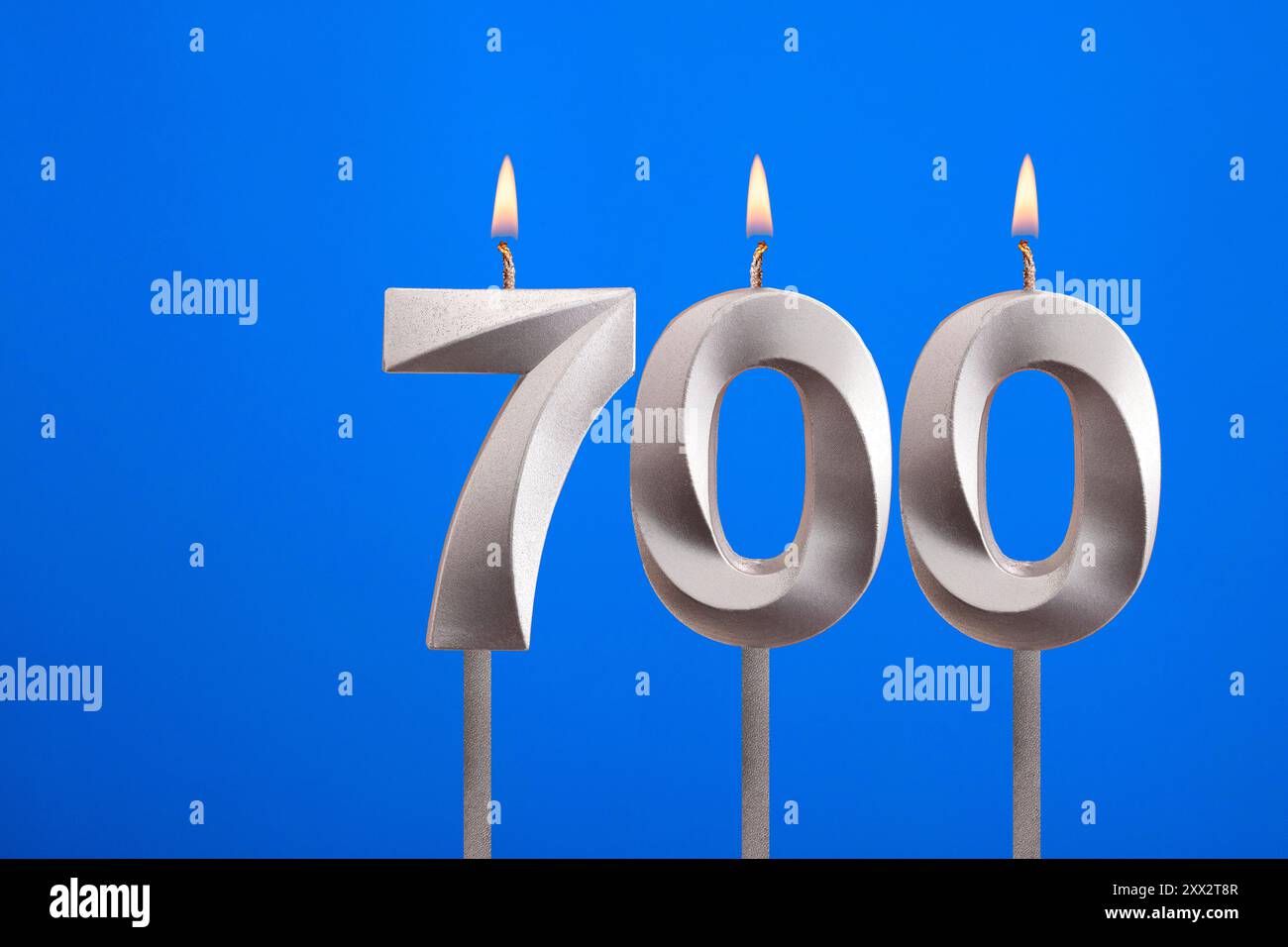 Birthday candle number 700 - Celebration card on blue background Stock ...