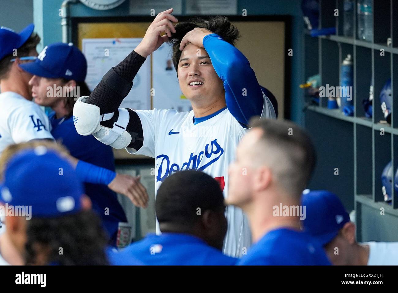 Los Angeles Dodgers designated hitter Shohei Ohtani (17) adjusts his ...