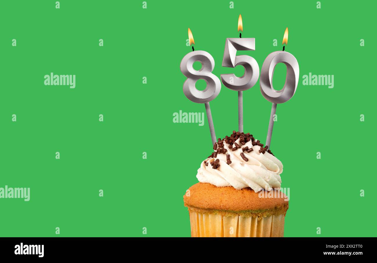 Birthday with number 850 candle and cupcake - Anniversary card on green ...