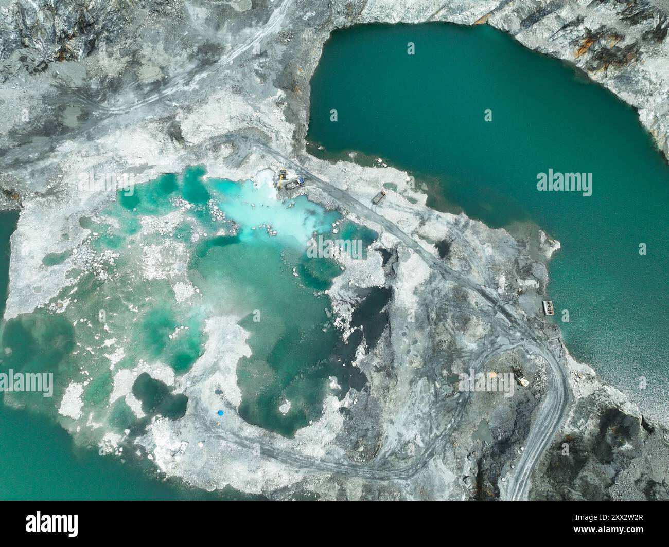 Open pit mine industry. Limestone quarry with backhoe and truck in ...