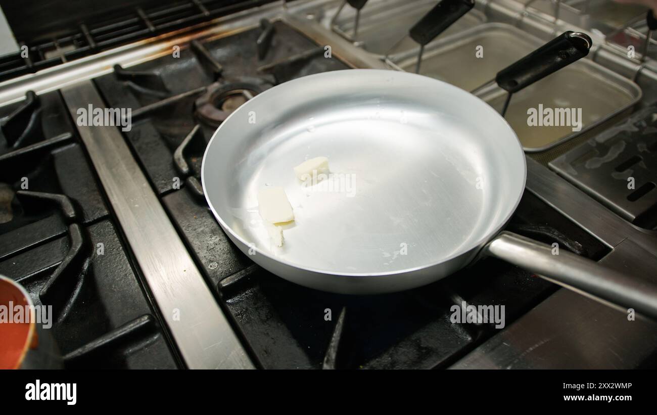 Butter Melting Inside A Frying Pan Stock Photo - Alamy