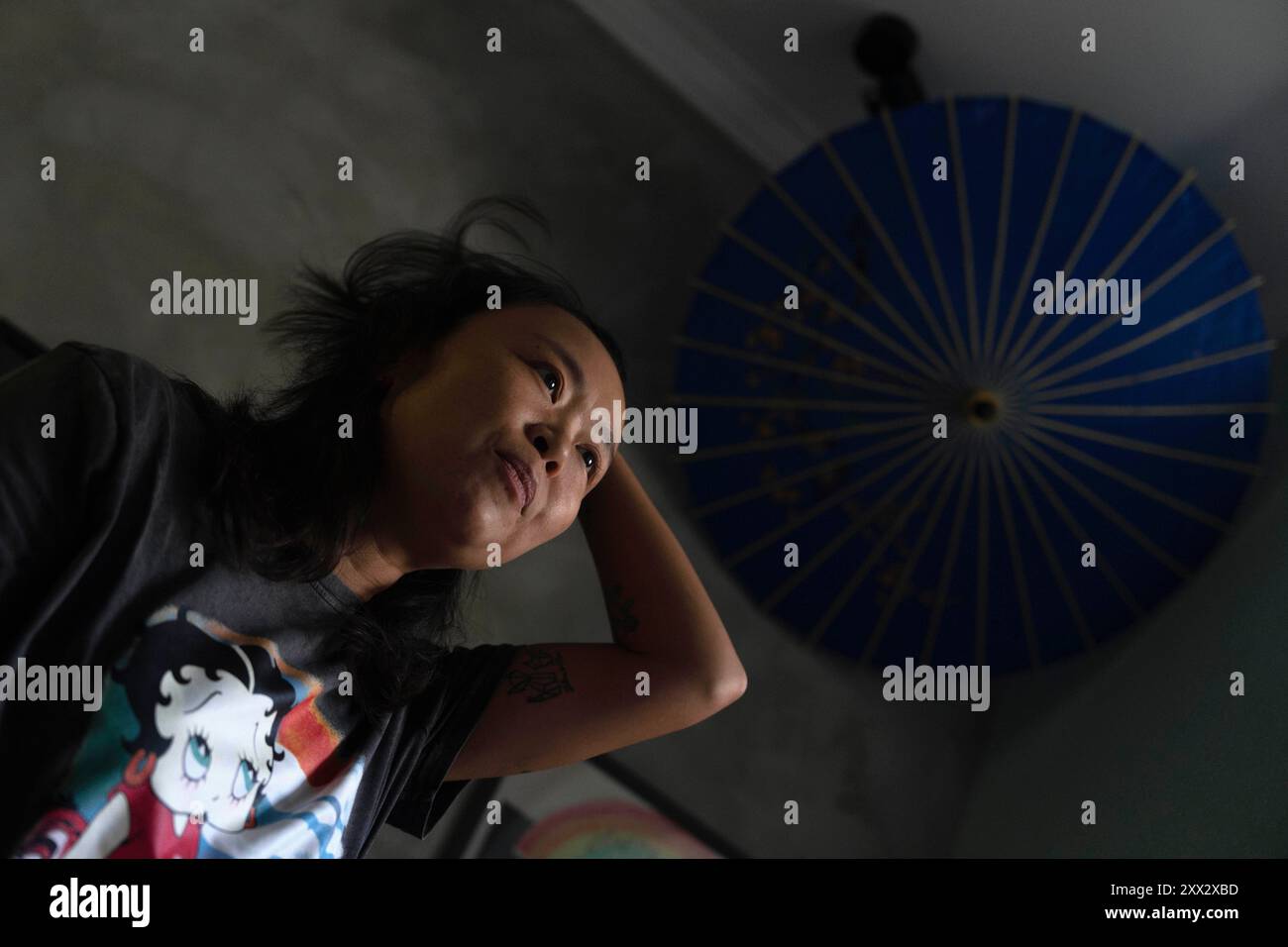 Zhang Peiyi, a Shanghai resident, reacts during an interview at her ...