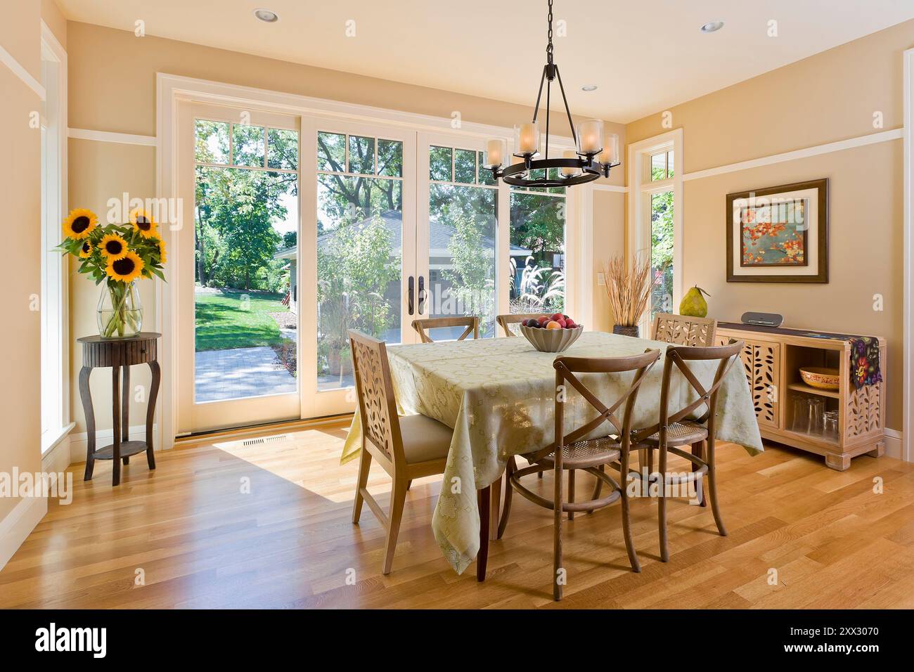 Sun streams into dining room through sliding glass doors Stock Photo ...
