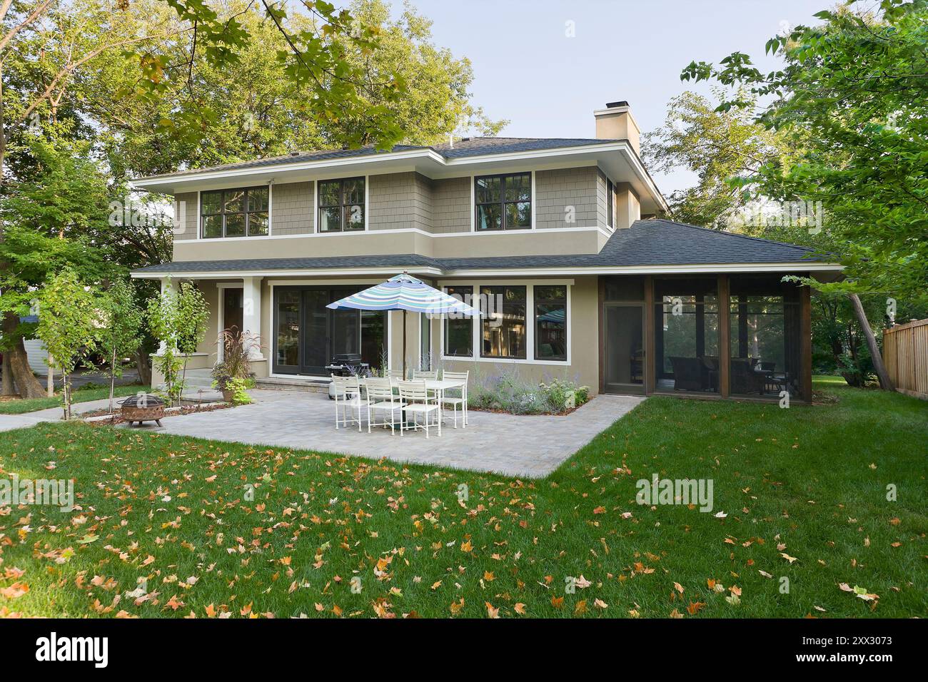 Back of remodeled four square house with stucco lower half and cedar ...
