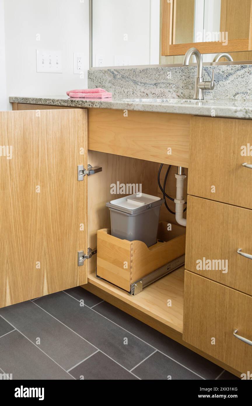 Area under bathroom sink with pull-out drawer for small lidded trash ...