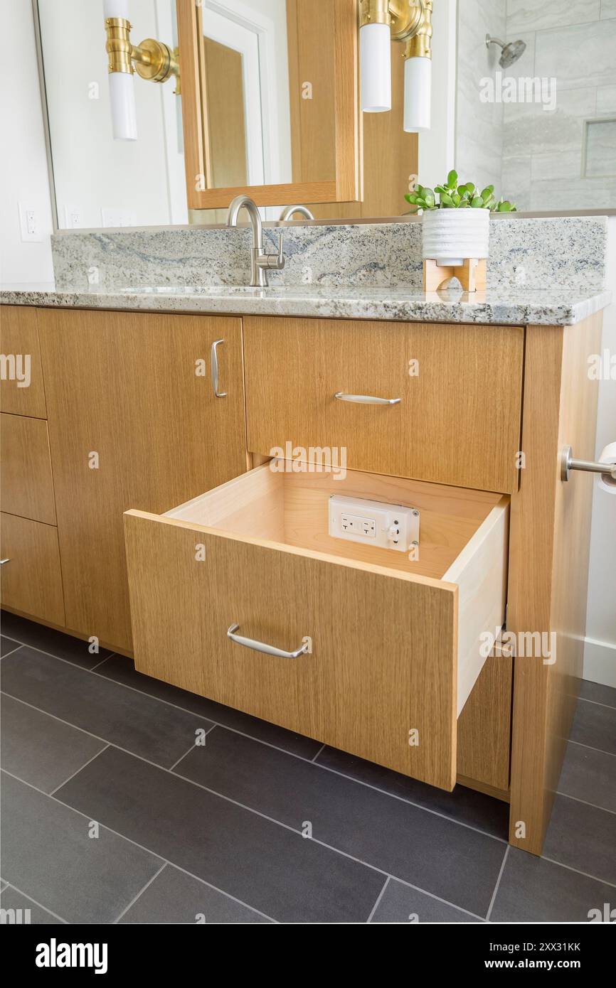 Electrical outlet built into back of bathroom vanity drawer Stock Photo ...