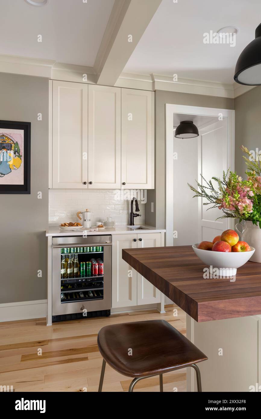Kitchen with cream colored cabinets and walnut countertop Stock Photo ...