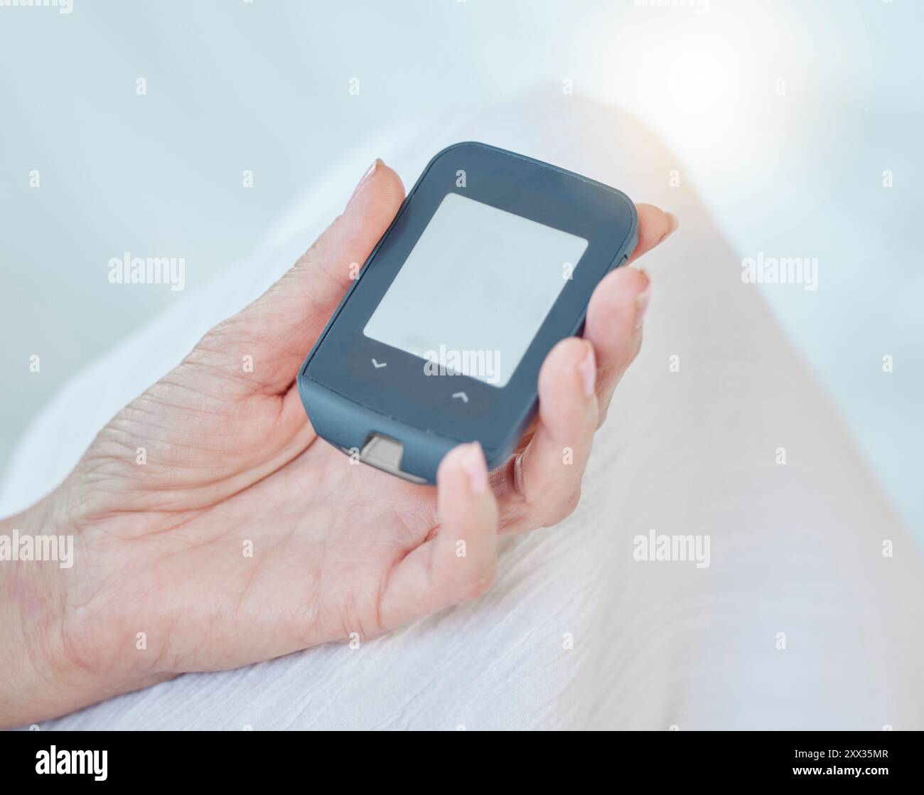 Glucometer, hands and screen for health in home for blood, stats and ...
