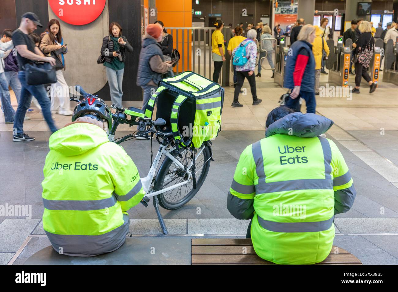 Uber eats delivery riders take a lunch break in Chatswood Sydney with ...