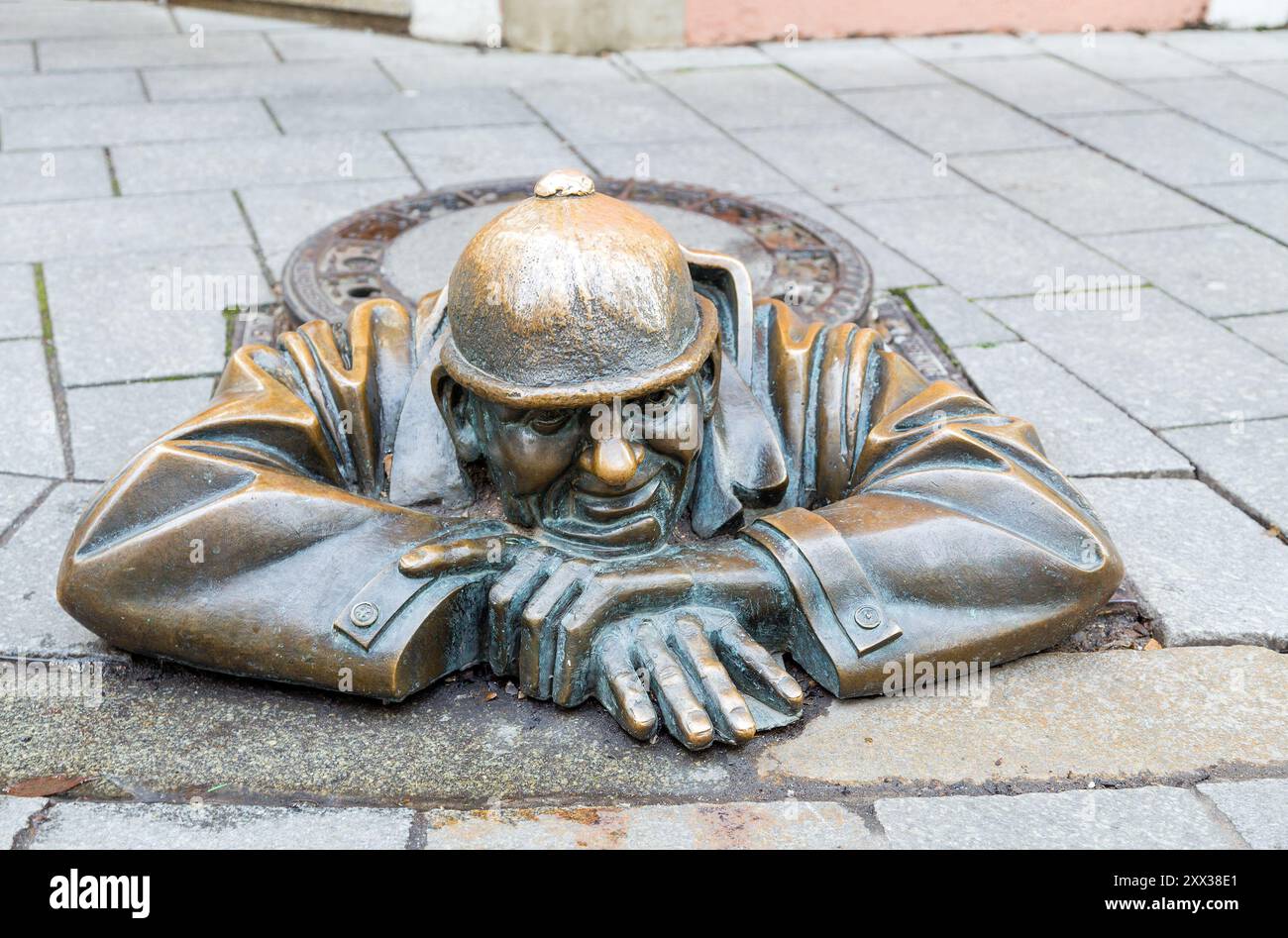 Cumil the Peeper, a famous street statue in Bratislava. It was made in ...