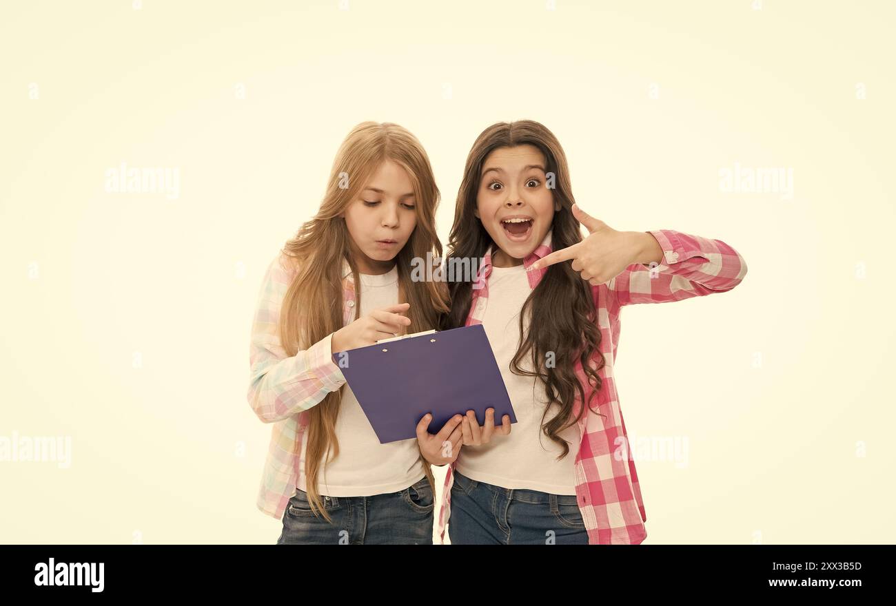 After examination. Excited children checking up examination result in ...