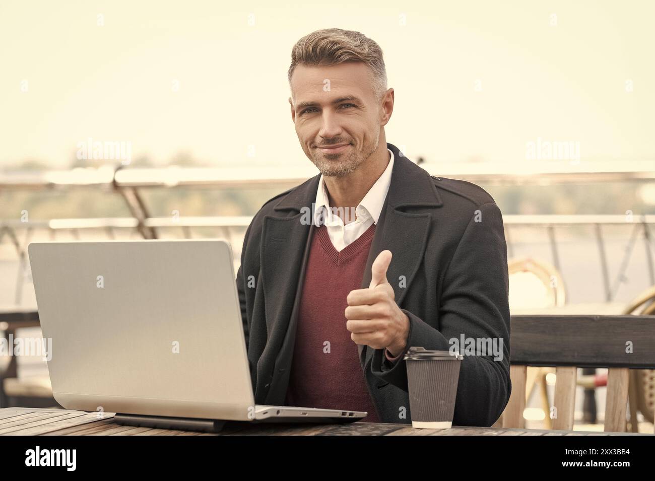 Businessman making thumbs up working hi-res stock photography and ...