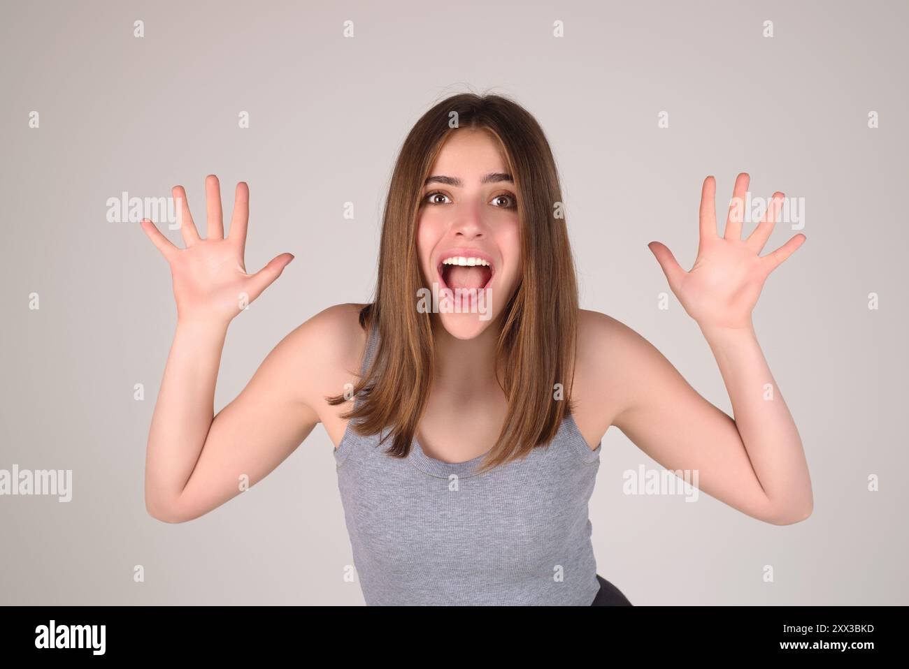 Girl raising eyebrows being surprised and shocked. Astonished reaction ...