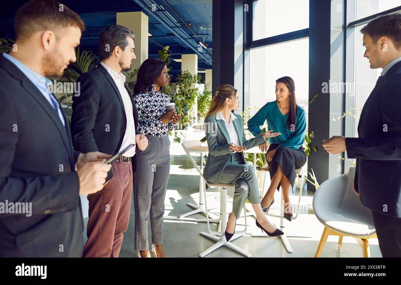 Office diverse business colleagues gathering in boardroom hall, female coworkers brainstorm ...