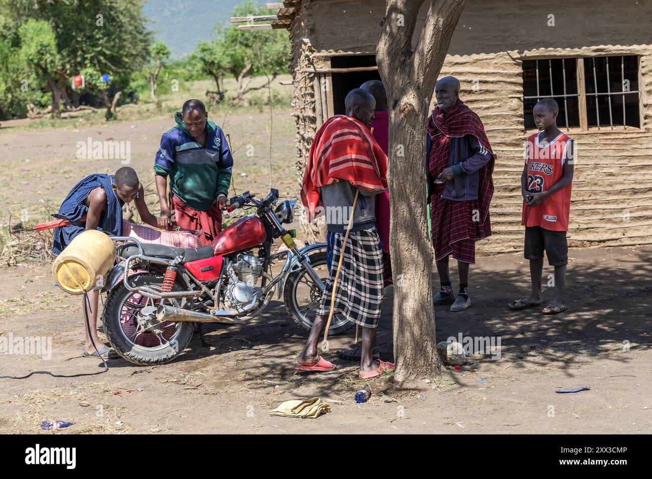 Market day in Maasai village, motorcycle and men, Engaruka, Arusha ...