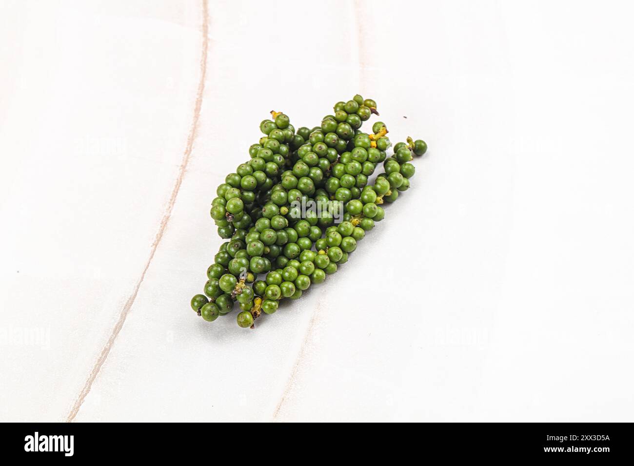 Green pepper corn on the branch heap Stock Photo - Alamy
