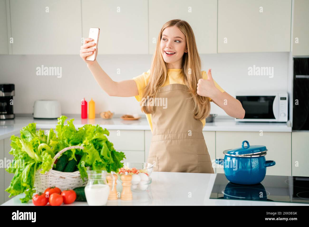 Photo of charming adorable girl chef cooking meal soup nice recipe ...
