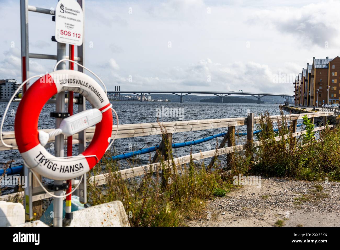 Buildings, a lifebuoy and the Sundsvall bridge in the city of Sundsvall ...