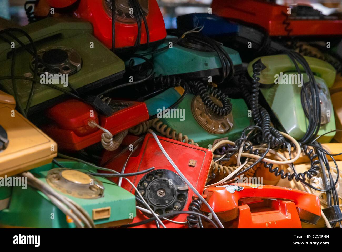 bunch of old colorful telephones with cables Stock Photo - Alamy